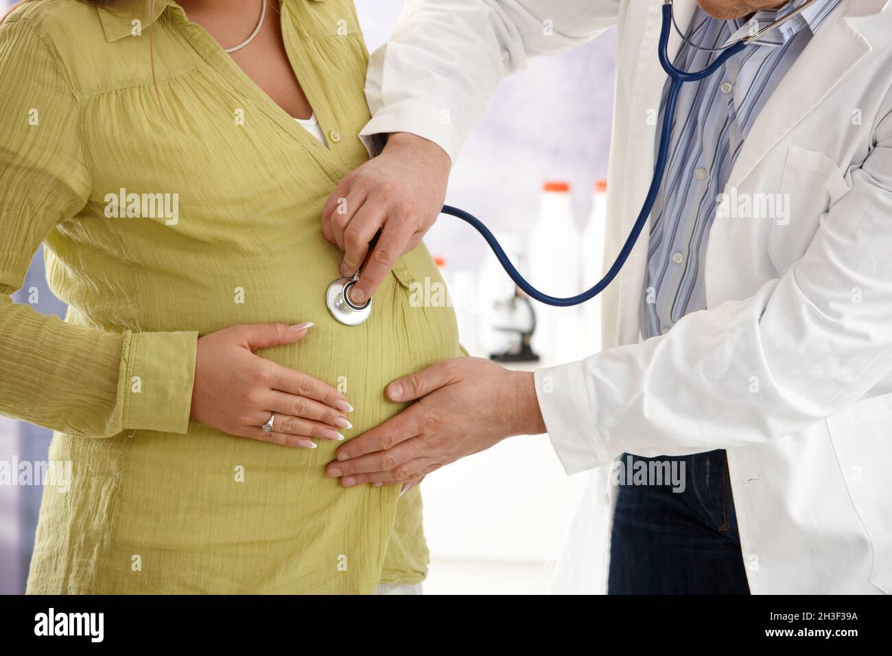 Checking pregancy with stethoscope Stock Photo - Alamy