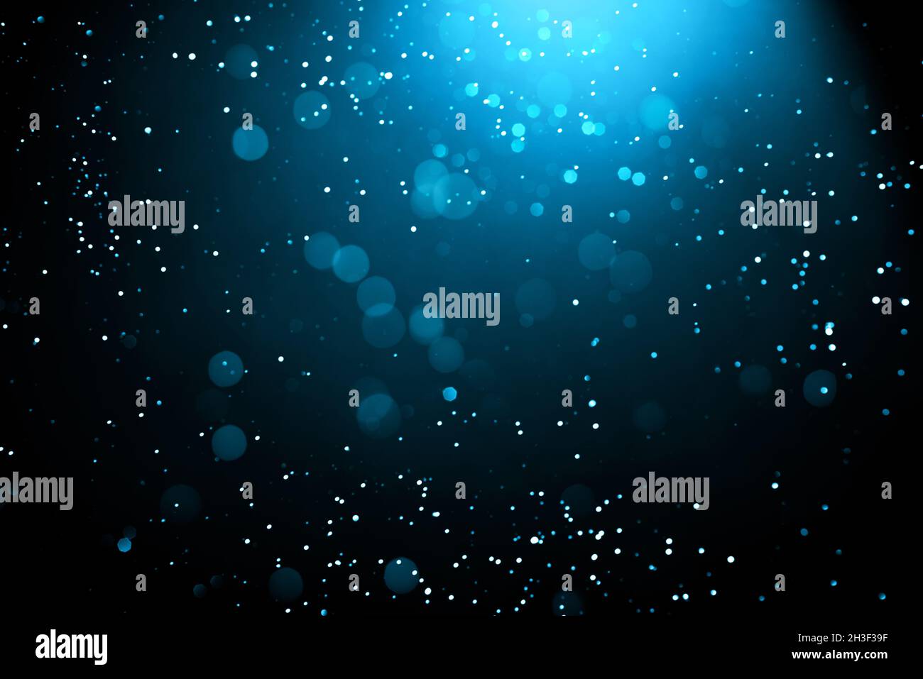 Abstract background with glowing turquoise particles Stock Photo - Alamy