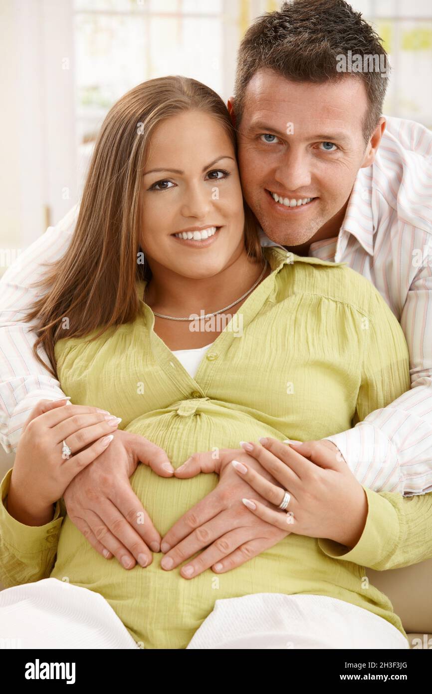 Portrait of expecting couple Stock Photo - Alamy