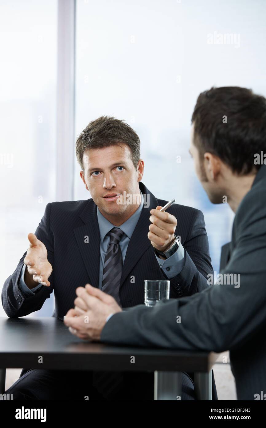 Pay discussion hi-res stock photography and images - Alamy