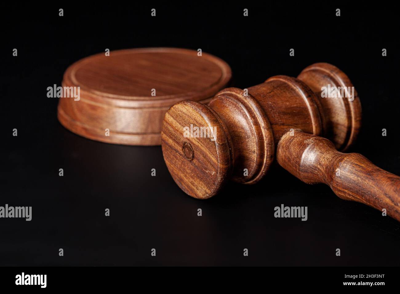 Wooden judges gavel on table close up Stock Photo - Alamy