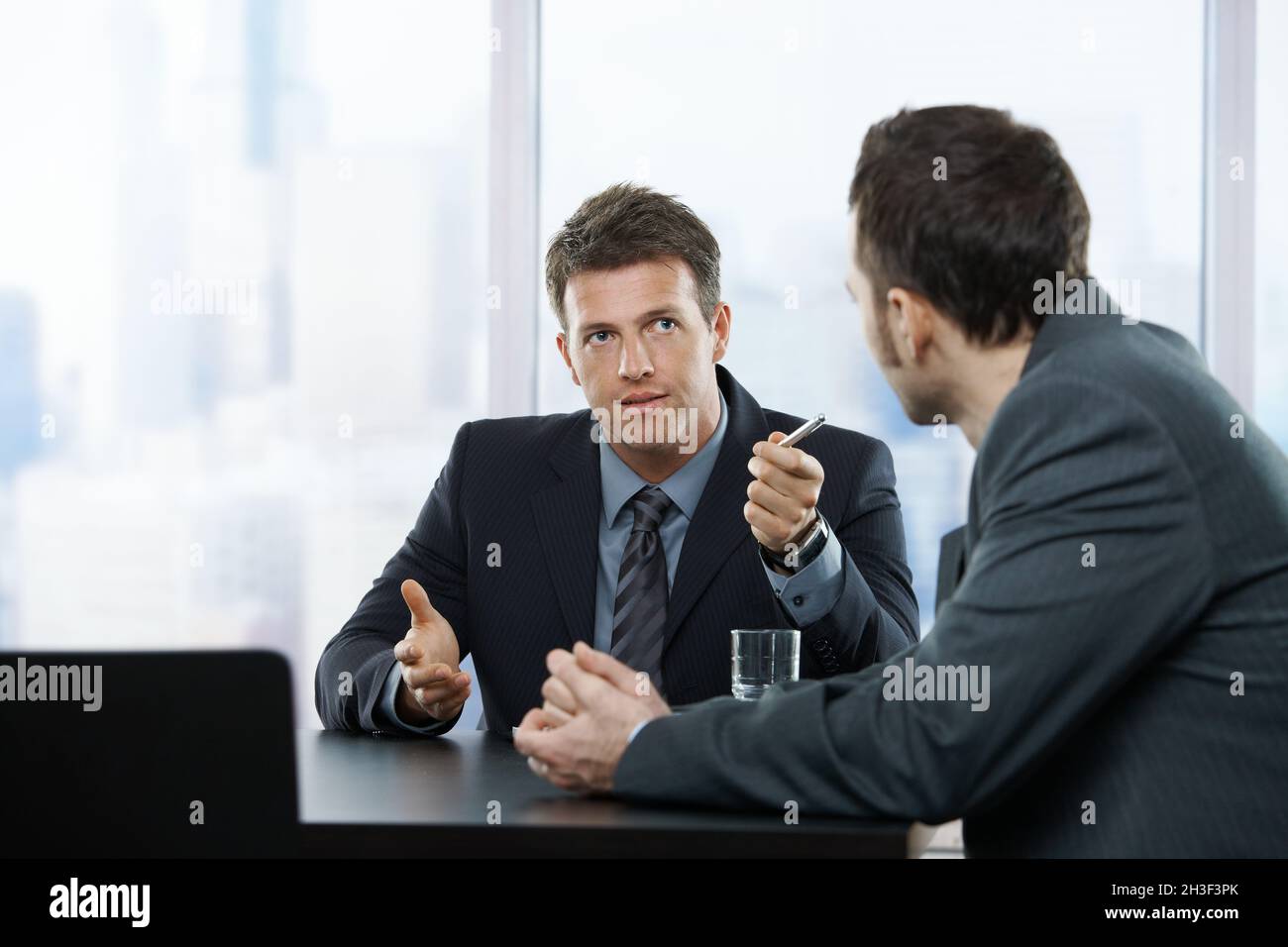 Pay discussion hi-res stock photography and images - Alamy