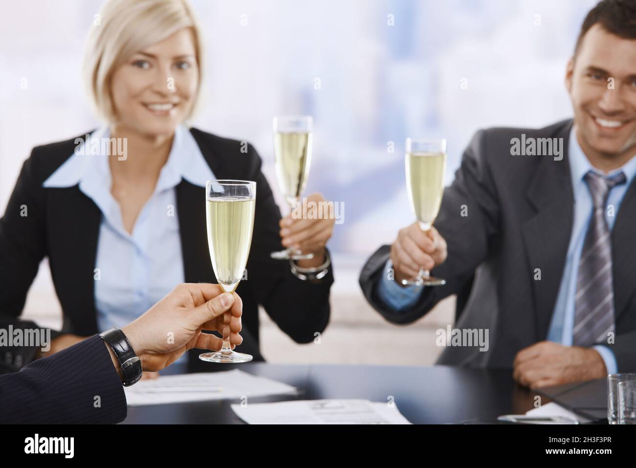 Business executives raising toast with champagne Stock Photo - Alamy