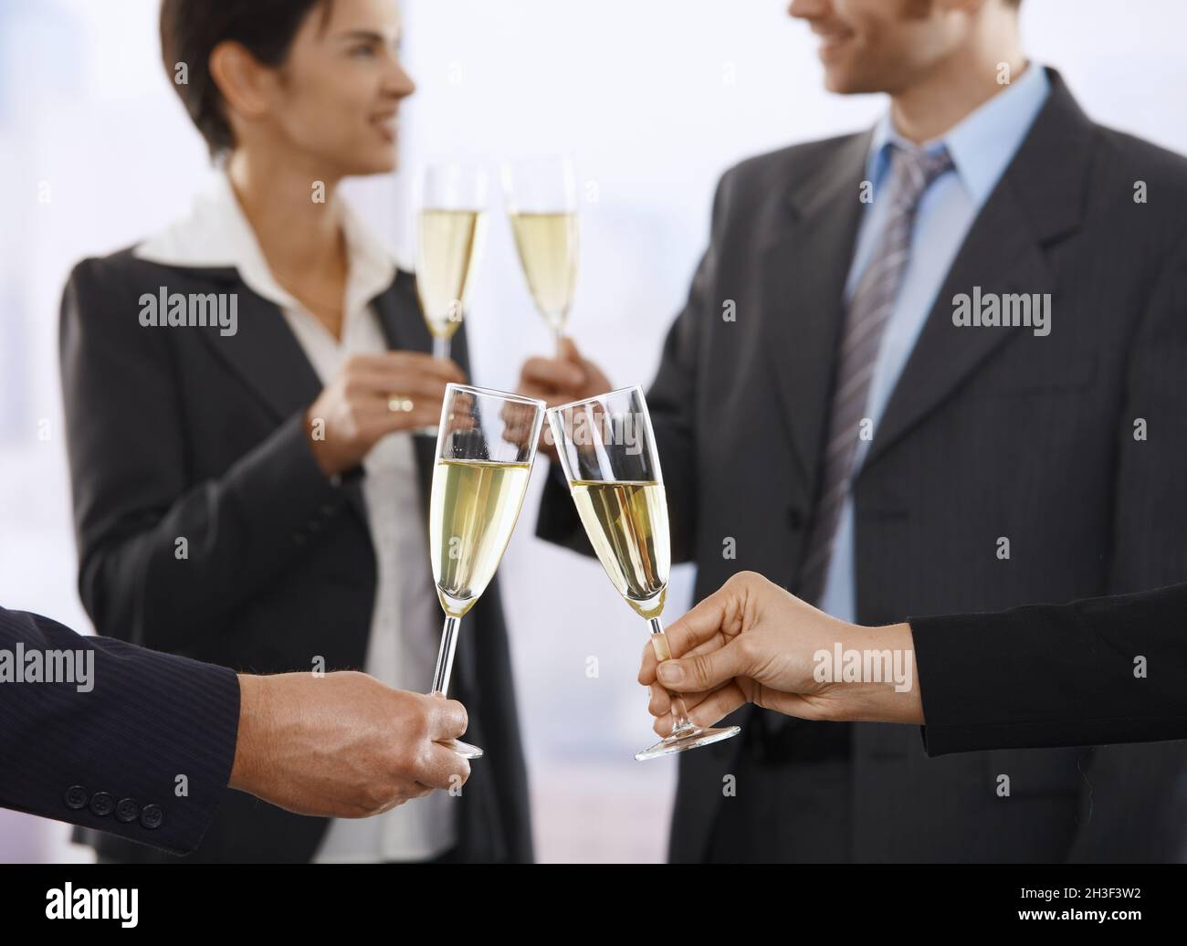 Business people raising toast with champagne Stock Photo - Alamy