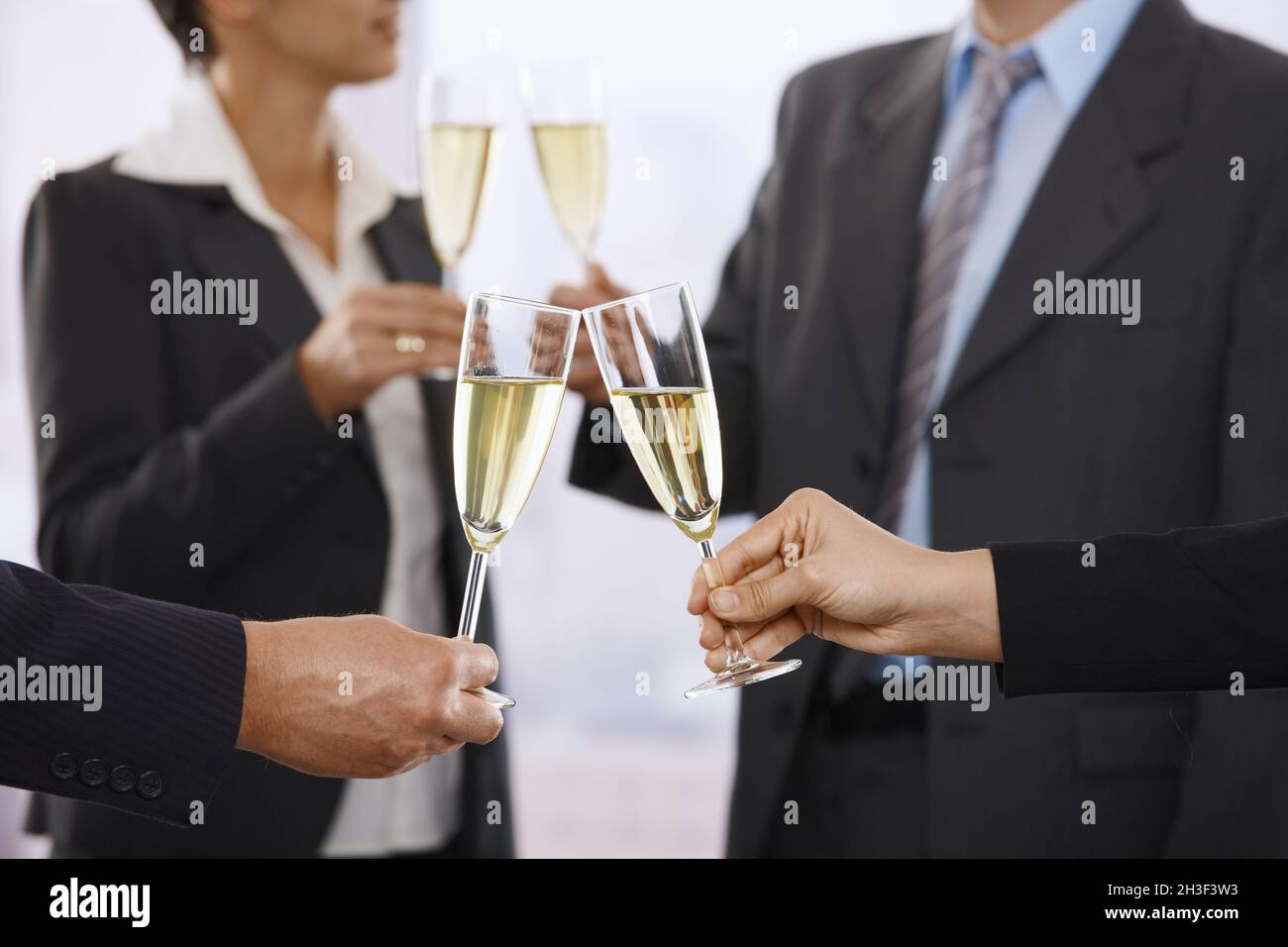 Business people raising toast with champagne Stock Photo - Alamy