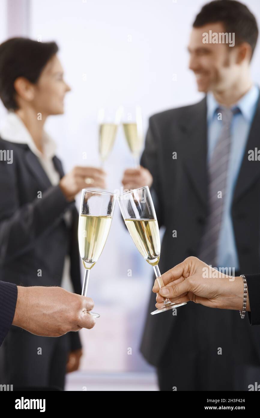 Business people raising toast with champagne Stock Photo - Alamy
