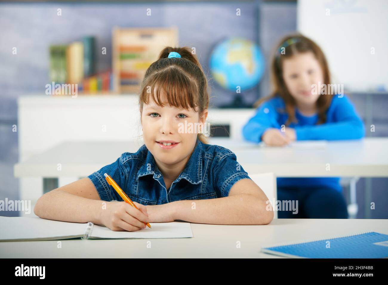 Schoolgirls in primary school classroom Stock Photo - Alamy