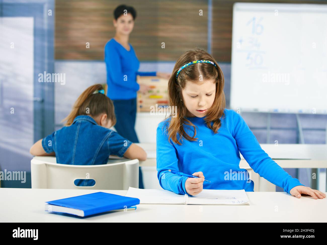 School kid writing test hi-res stock photography and images - Alamy