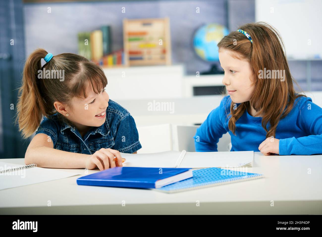 Children learning in classroom Stock Photo - Alamy