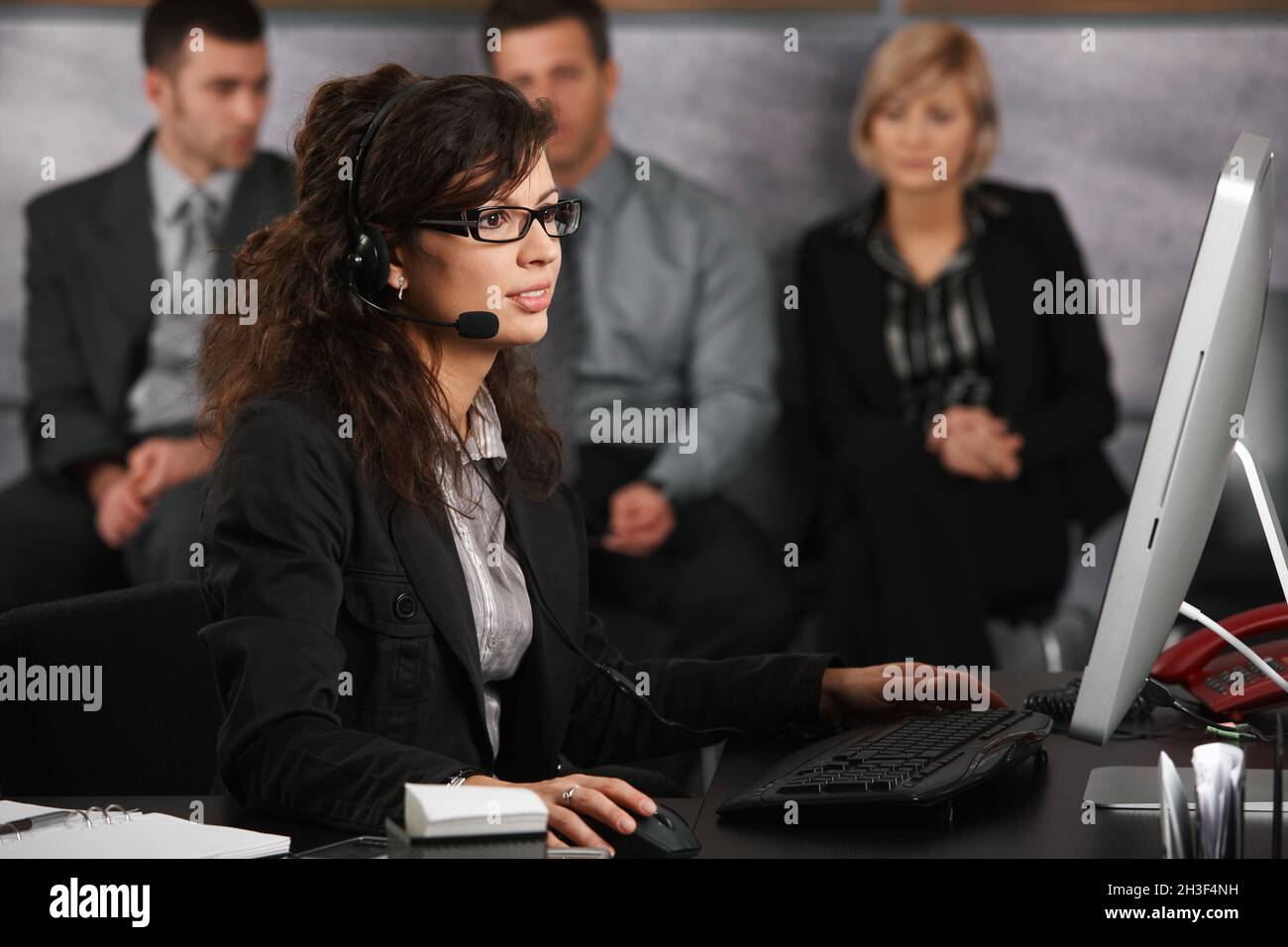 Receptionist at desk headset hi-res stock photography and images - Alamy