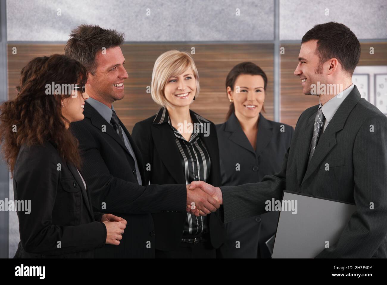 Business partners shaking hands Stock Photo - Alamy