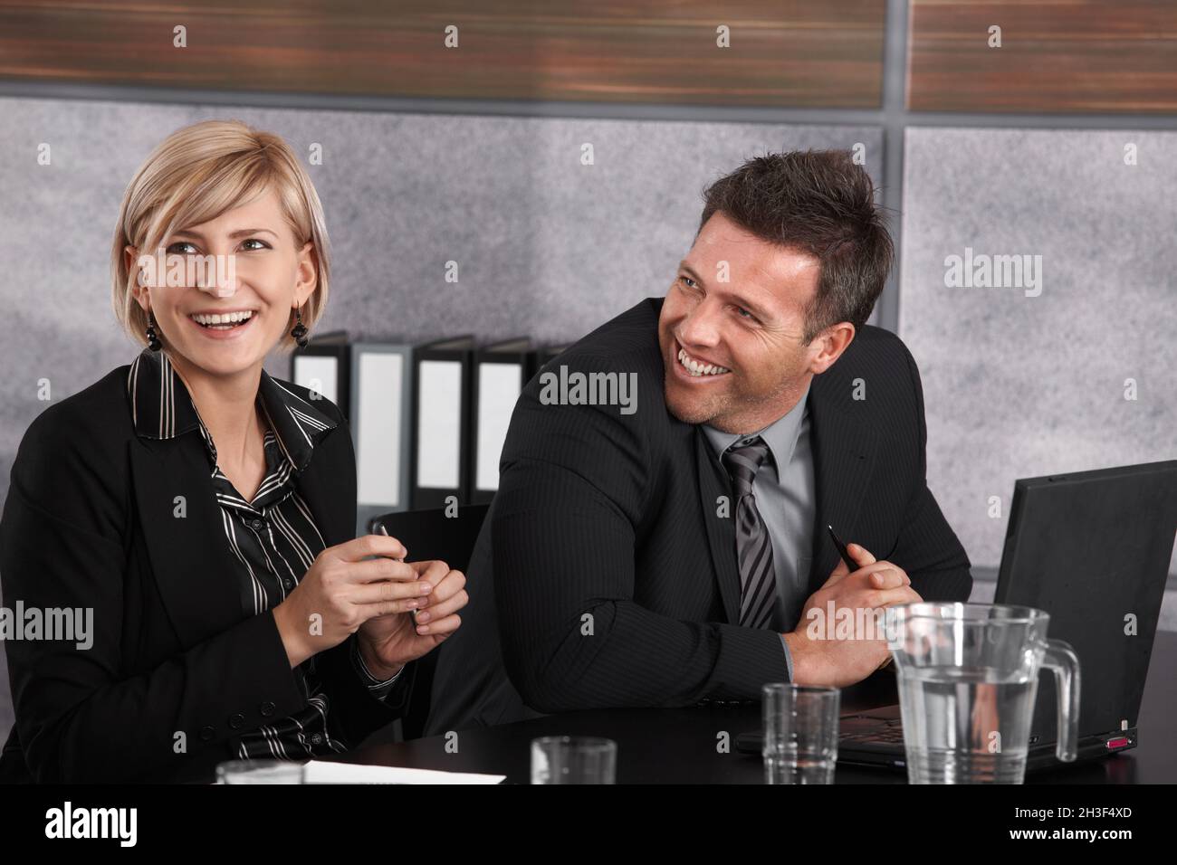 Cheerful business partners working hi-res stock photography and images ...