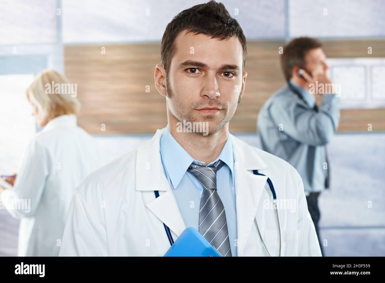 Doctor standing in corridor hi-res stock photography and images - Alamy