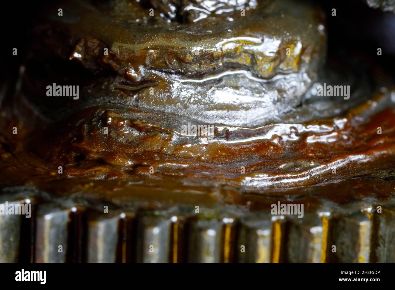 Worn grease can be seen inside the cog wheels unit. This is a partial ...