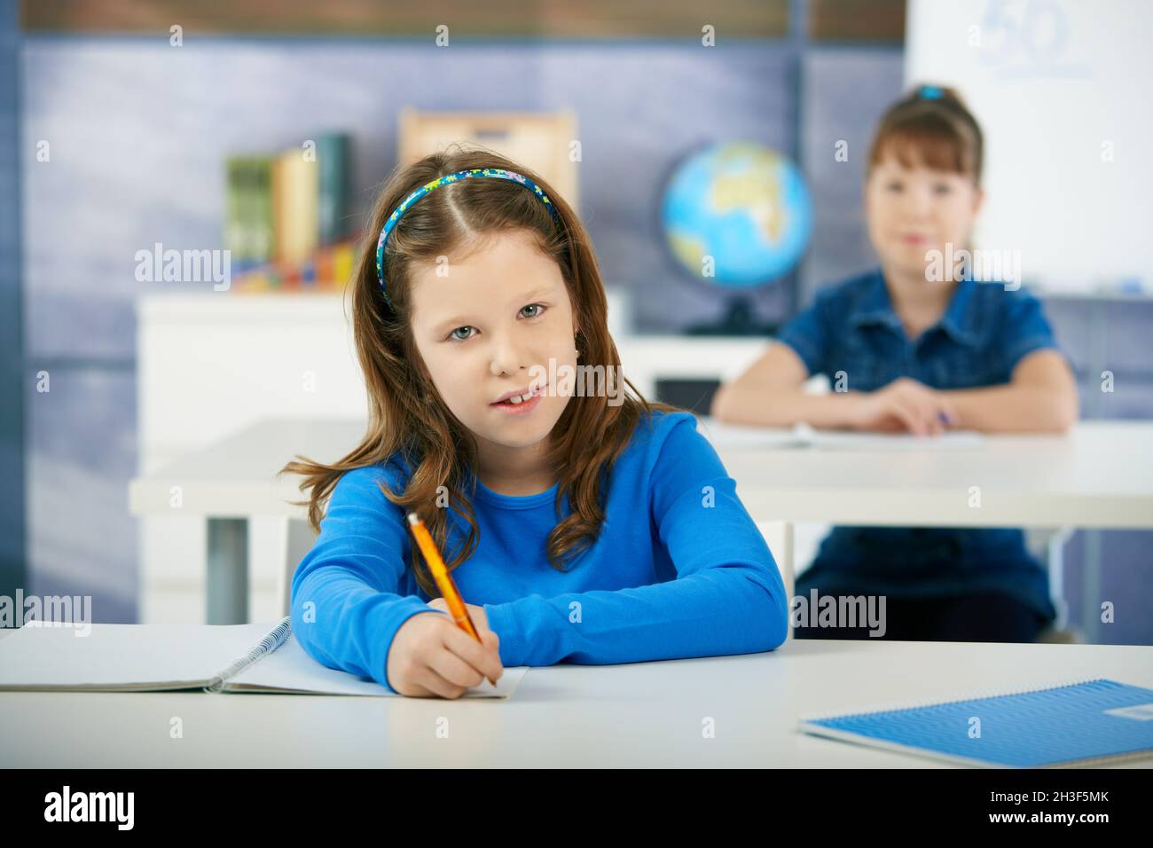 Children in elementary school classroom Stock Photo - Alamy