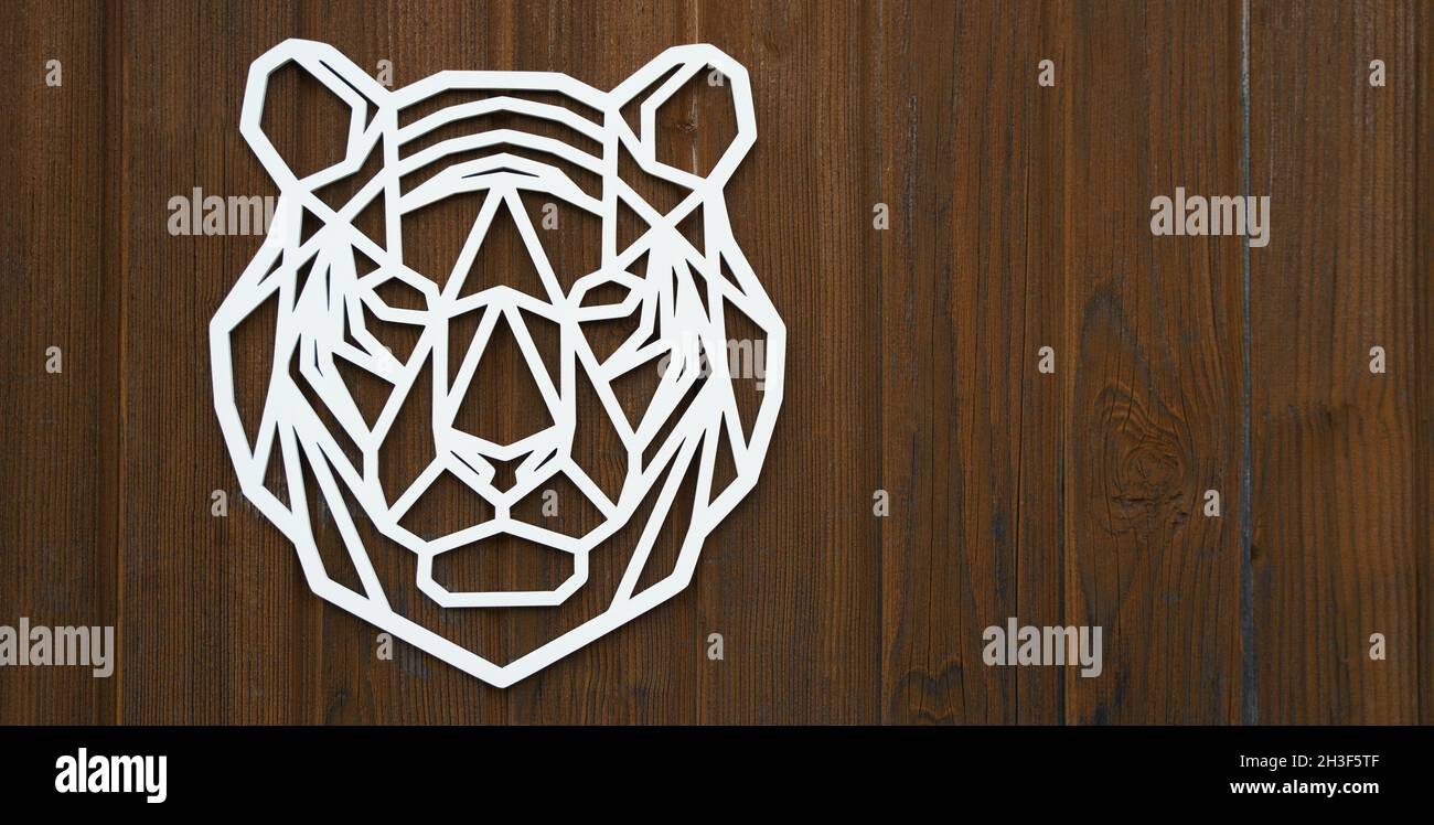 Large flat white tiger head on brown wooden wall background. Wooden ...