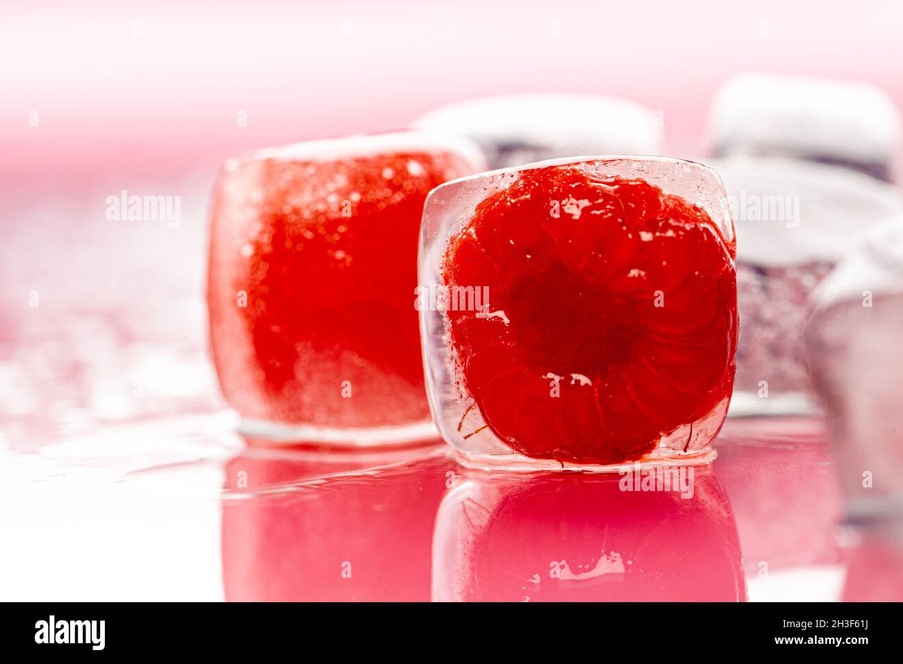 Berry ice cubes for decorating beverages close up Stock Photo - Alamy