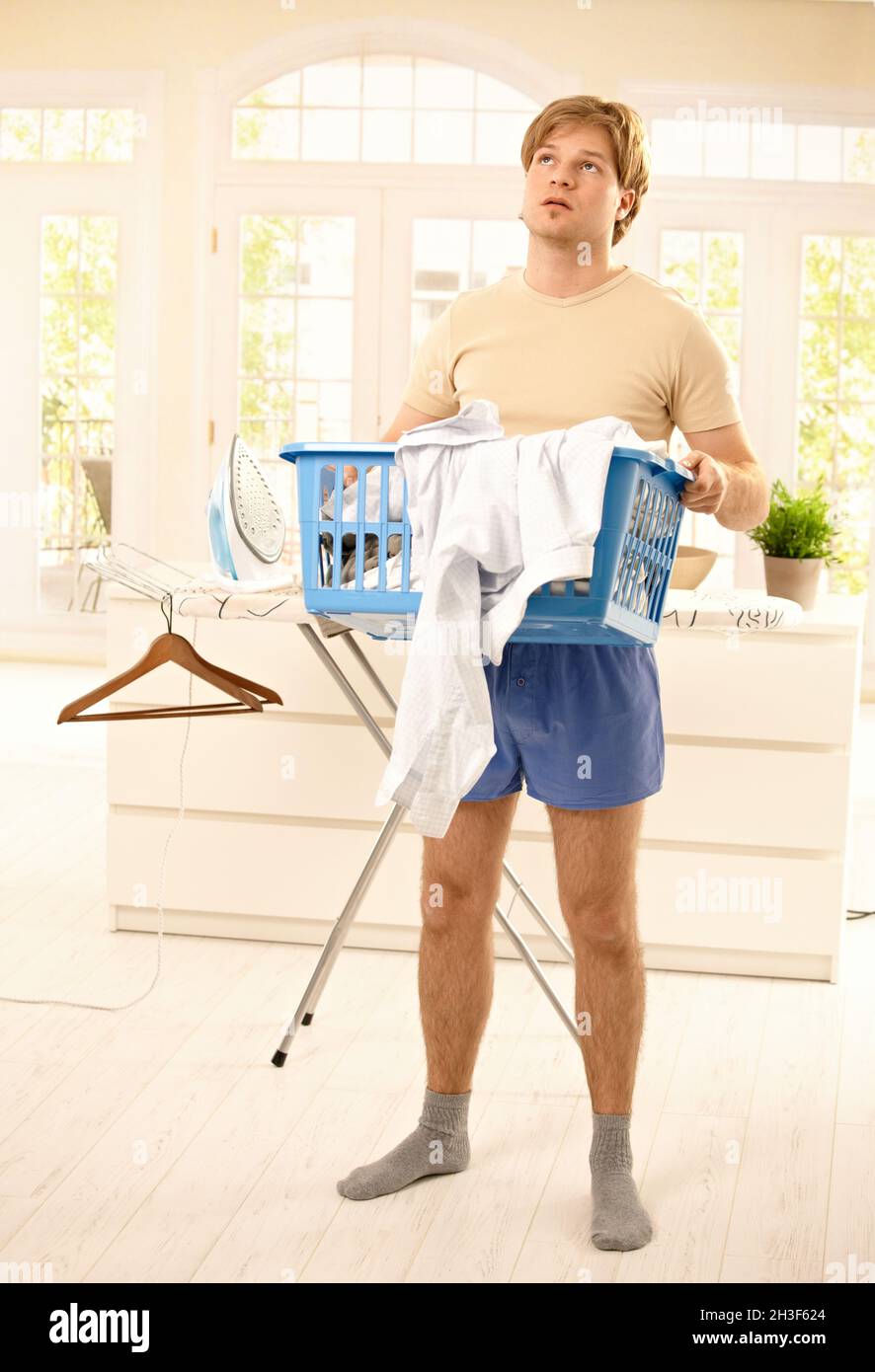 Guy fed up with housework Stock Photo - Alamy