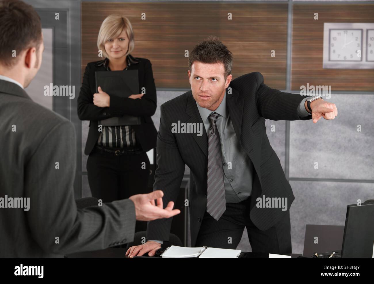 Executive firing employee Stock Photo - Alamy