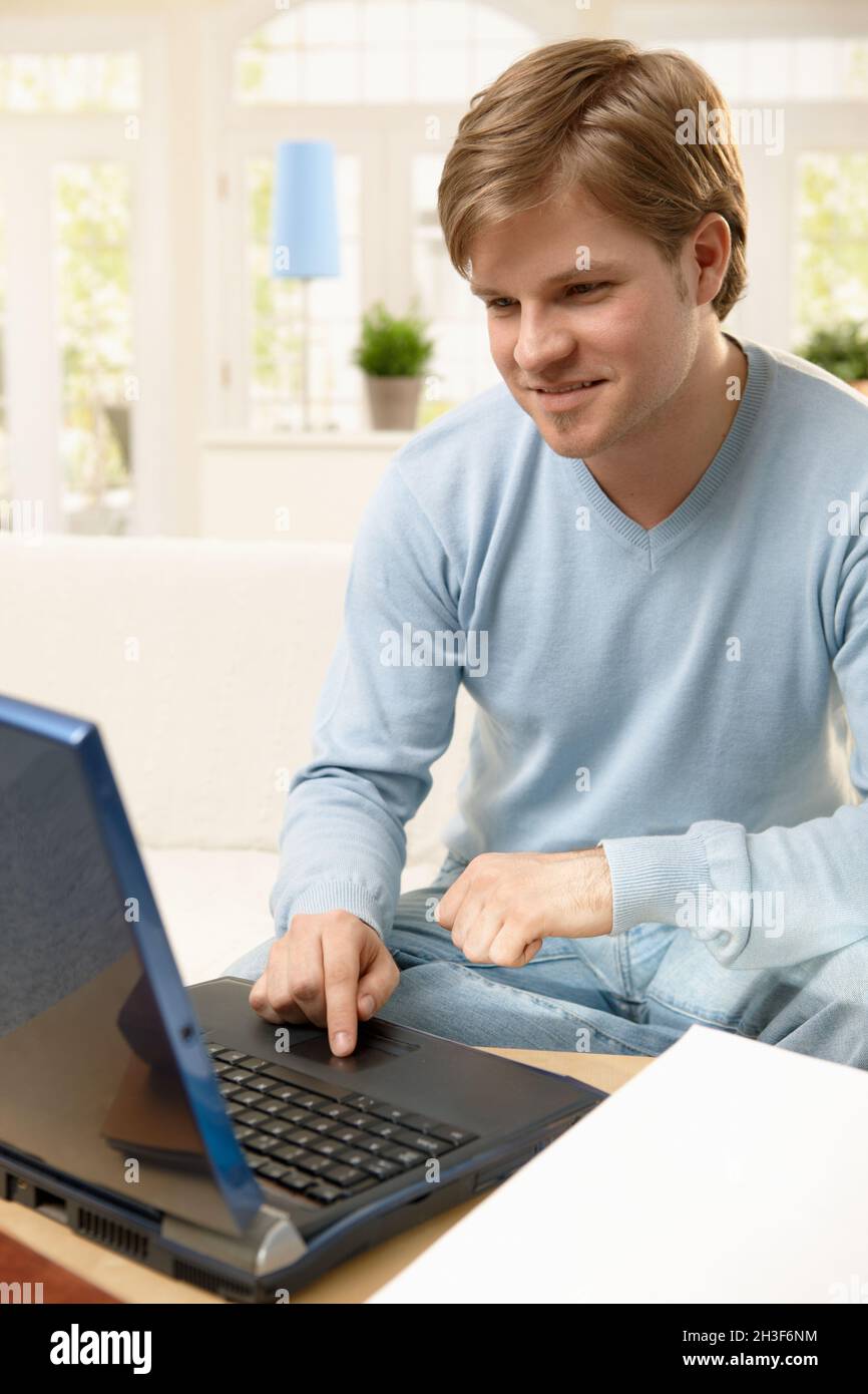 Guy browsing internet Stock Photo - Alamy