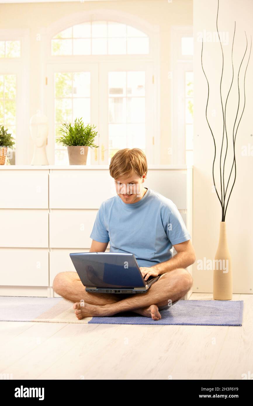 Guy with computer Stock Photo - Alamy
