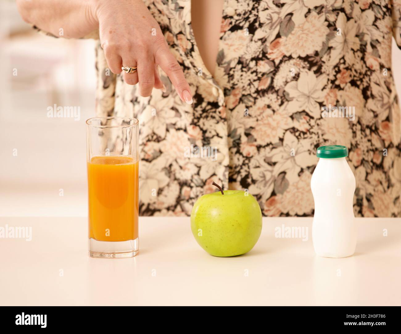 Woman pointing at healthy food Stock Photo - Alamy