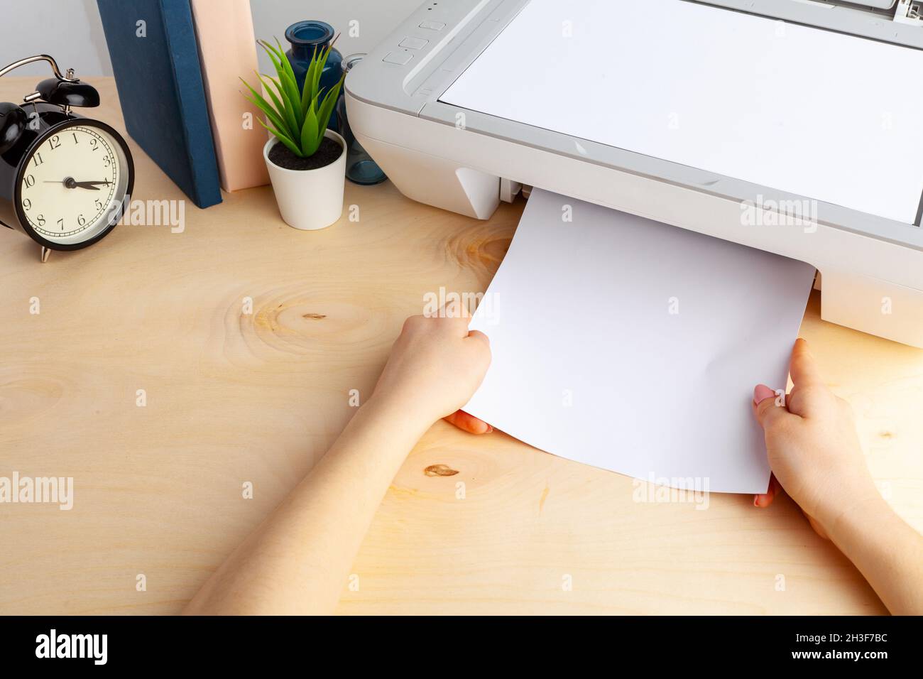 Close up of woman using a printer machine Stock Photo - Alamy