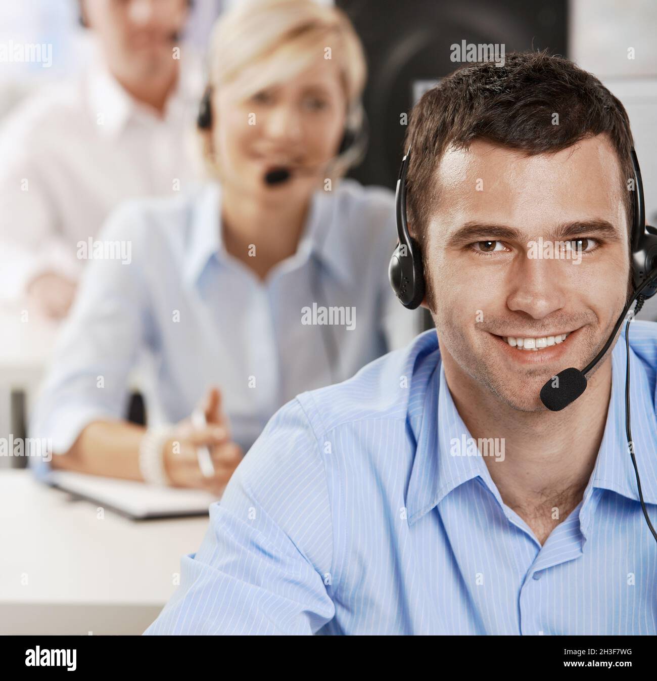 Operator talking on headset Stock Photo - Alamy