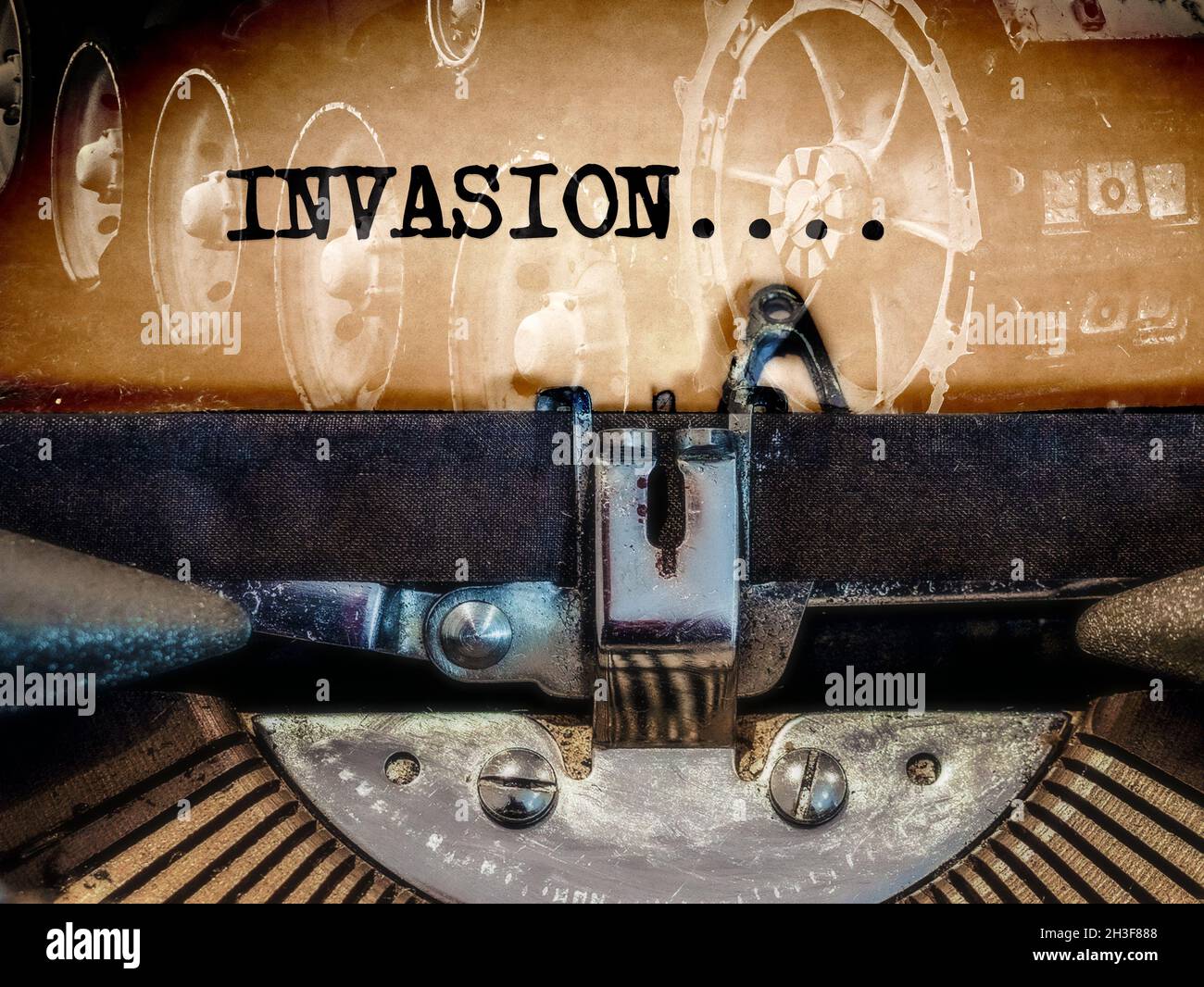 Invasion displayed on a classic Typewriter with tank caterpillar tracks ...