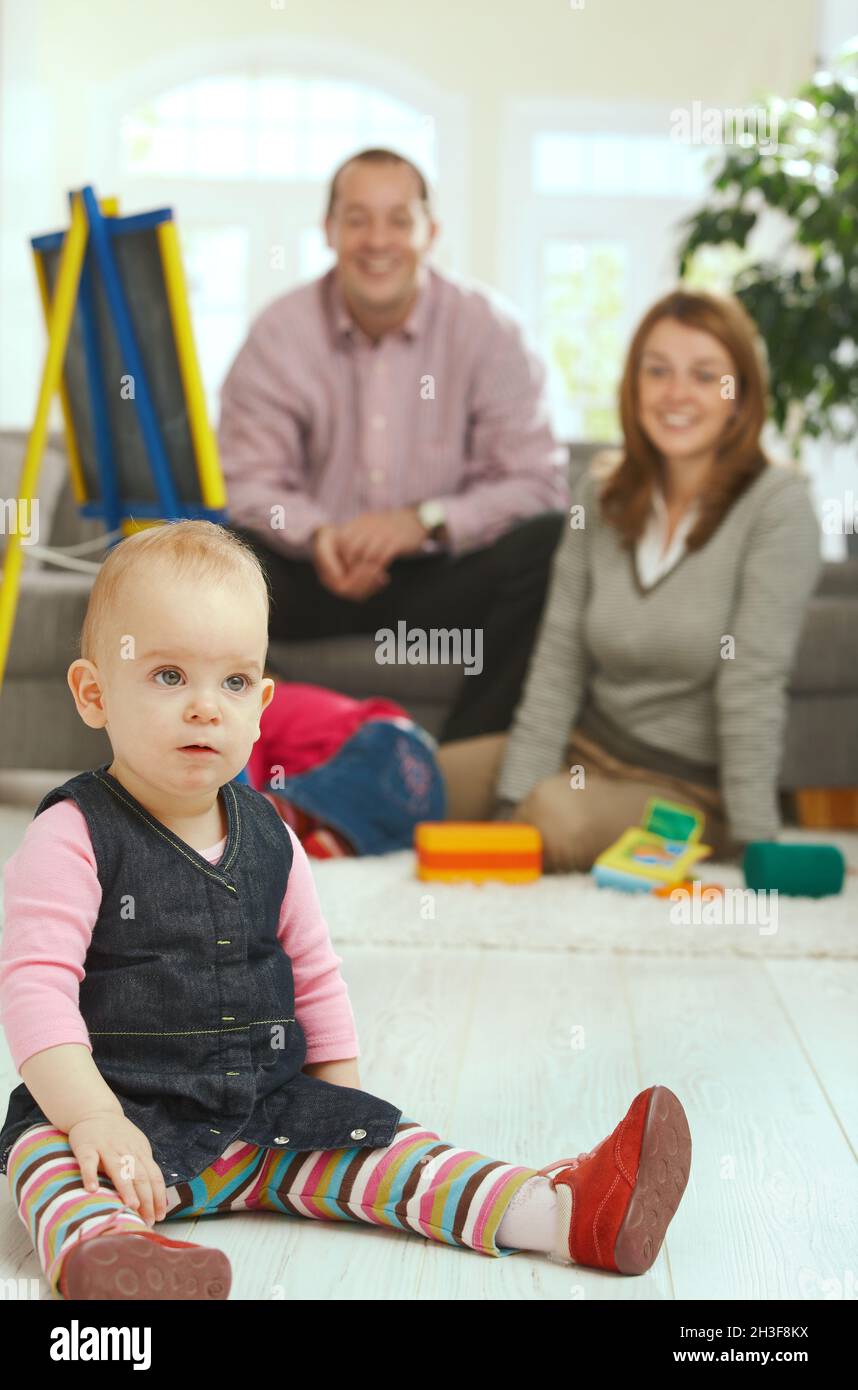 Baby sitting on floor Stock Photo - Alamy