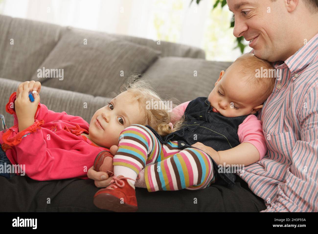 Dad with two daughters Stock Photo - Alamy