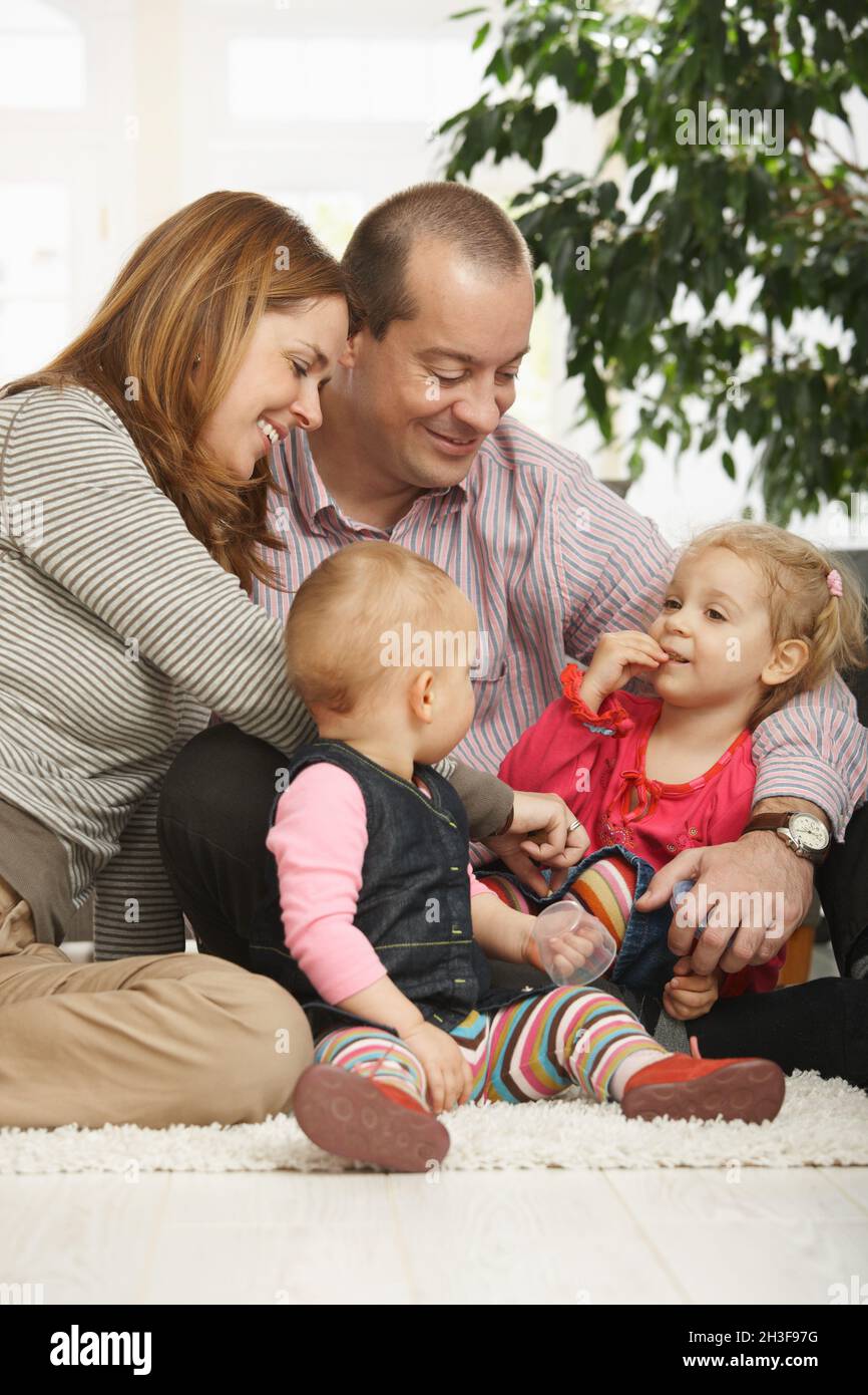 Happy family at home Stock Photo - Alamy