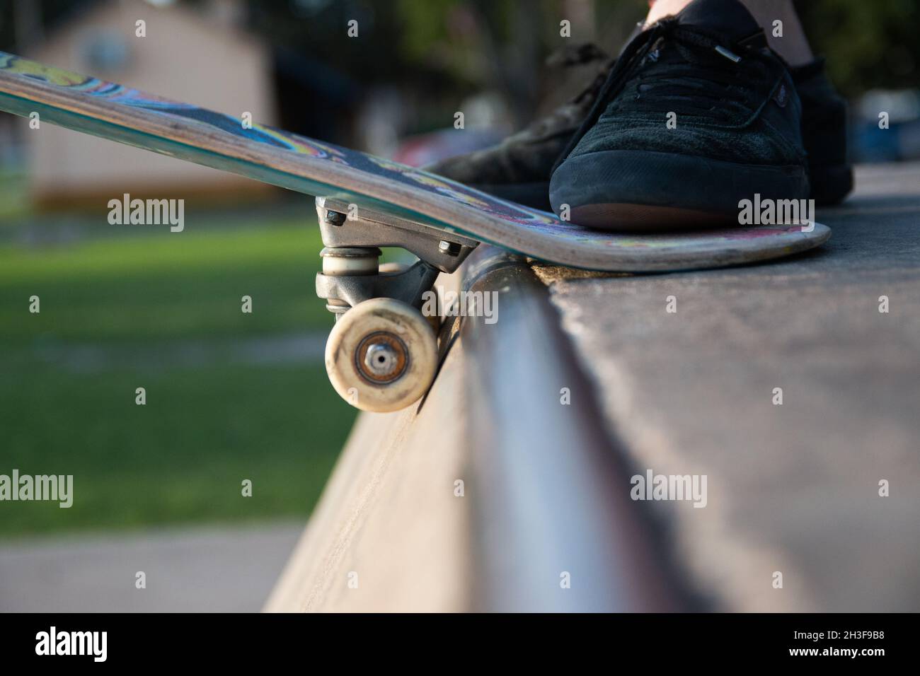 Close-up shot of a skateboard under the feet outdoors Stock Photo - Alamy
