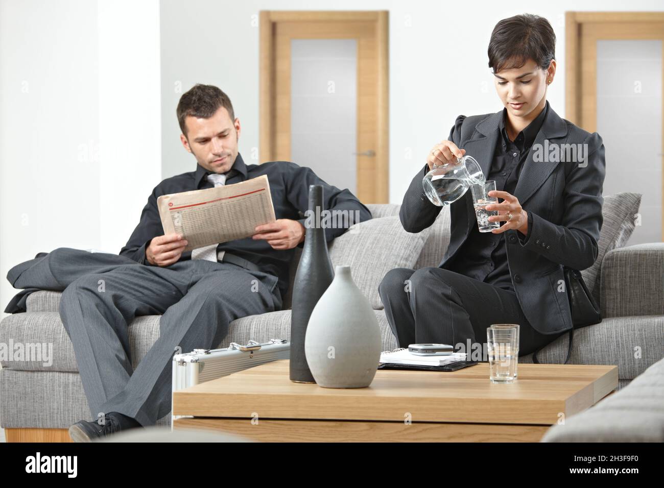 Business people waiting Stock Photo - Alamy