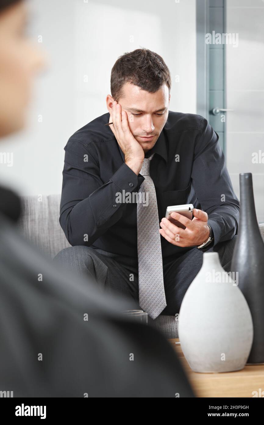 Businessman using palmtop Stock Photo - Alamy