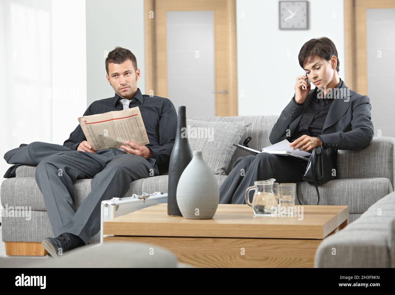 Business people waiting Stock Photo - Alamy