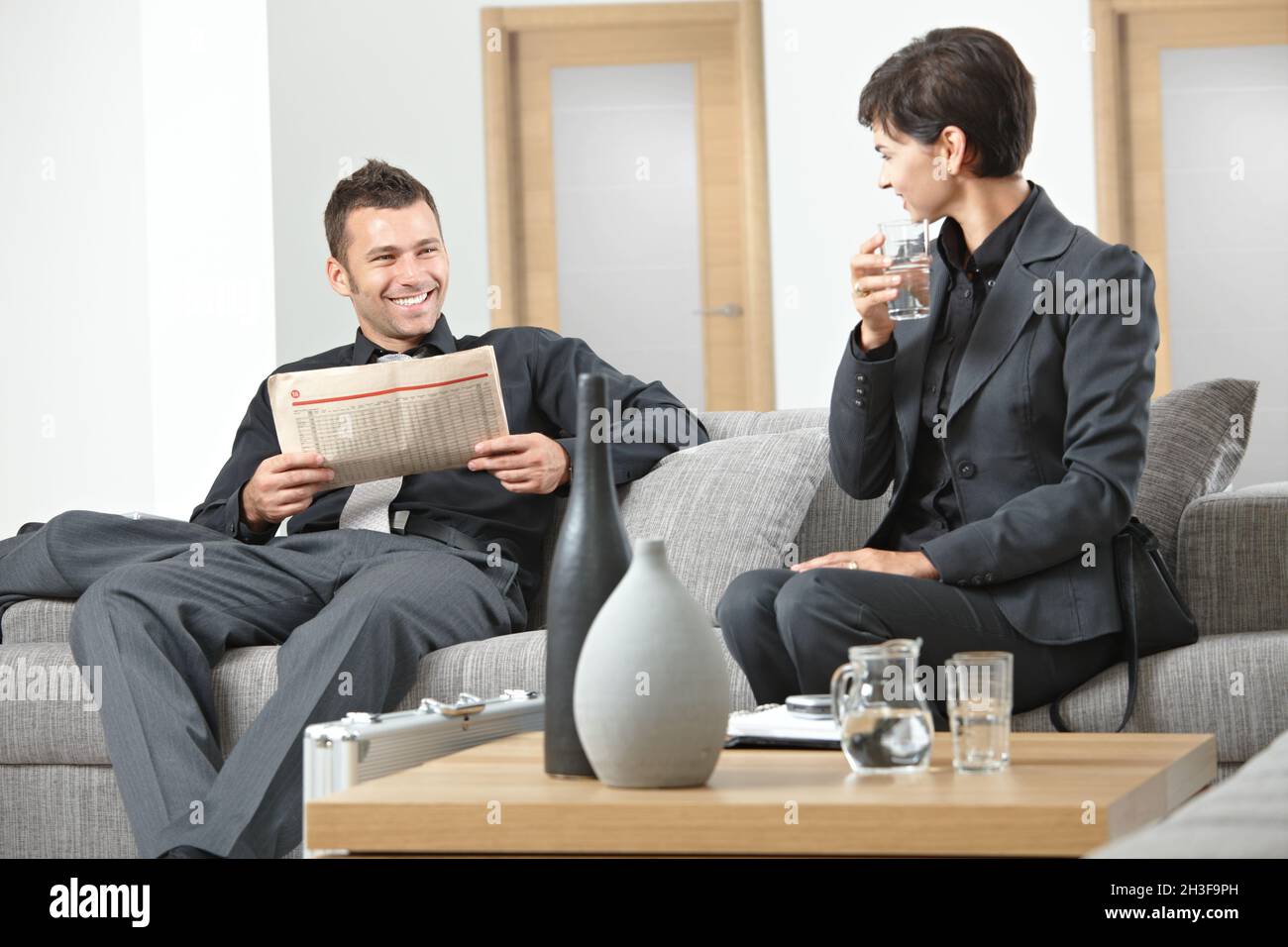 Business people waiting Stock Photo - Alamy