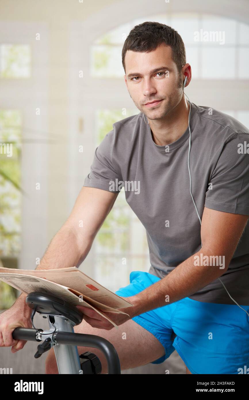 Exercise bike headphones male hi-res stock photography and images - Alamy