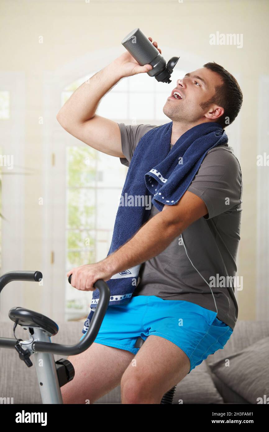 Man drinking water during exercise Stock Photo - Alamy