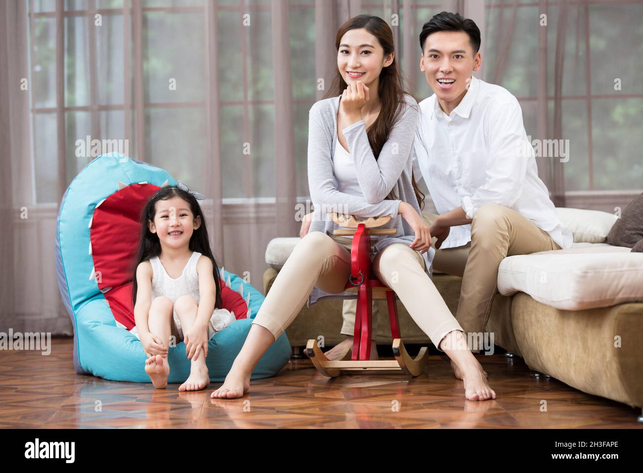 Warm and loving family of three Stock Photo - Alamy