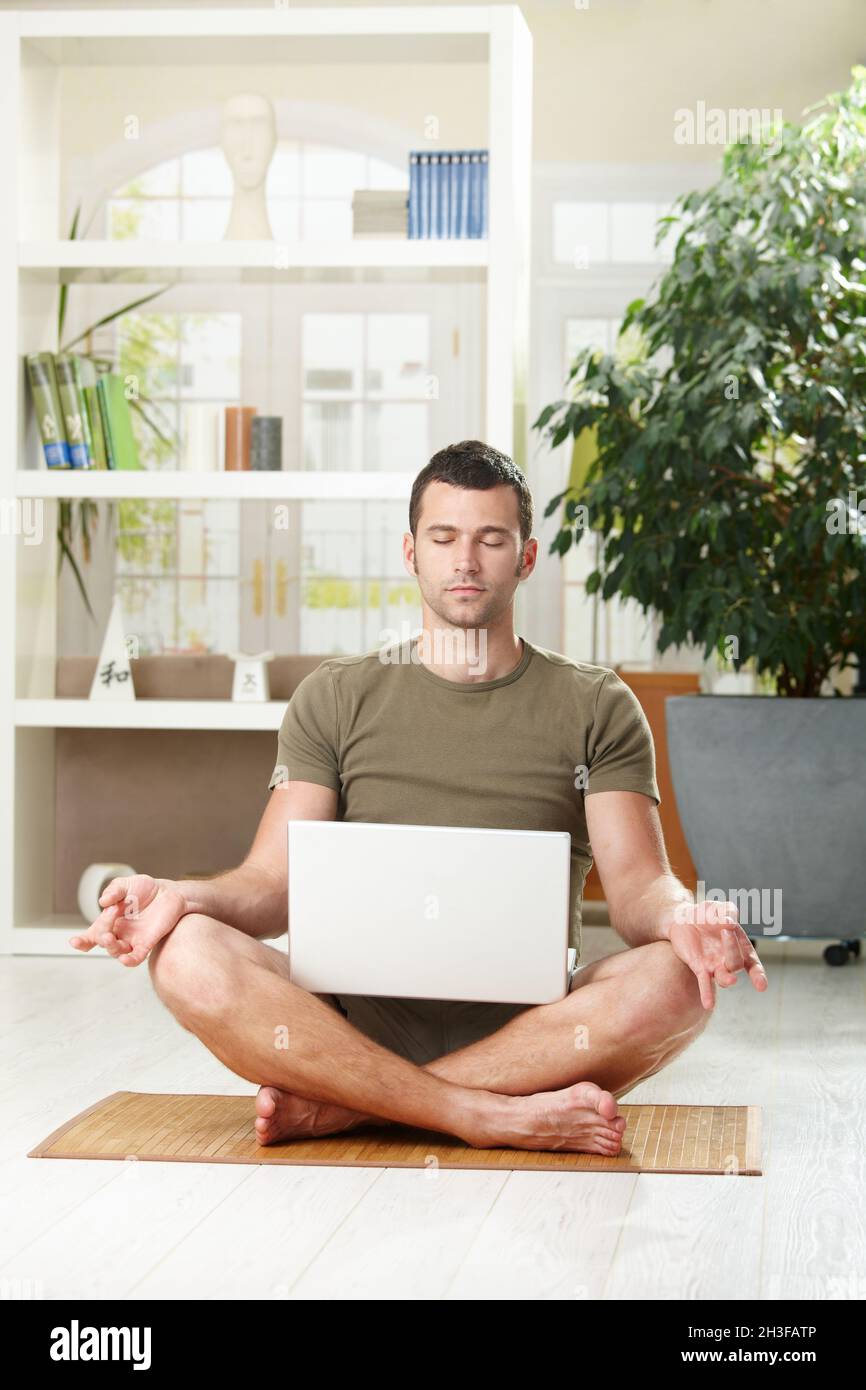 Muscular man holding laptop hi-res stock photography and images - Alamy