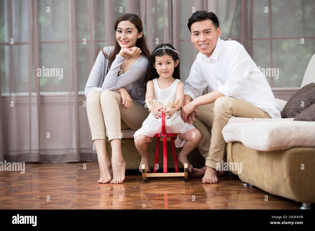 Warm and loving family of three Stock Photo - Alamy