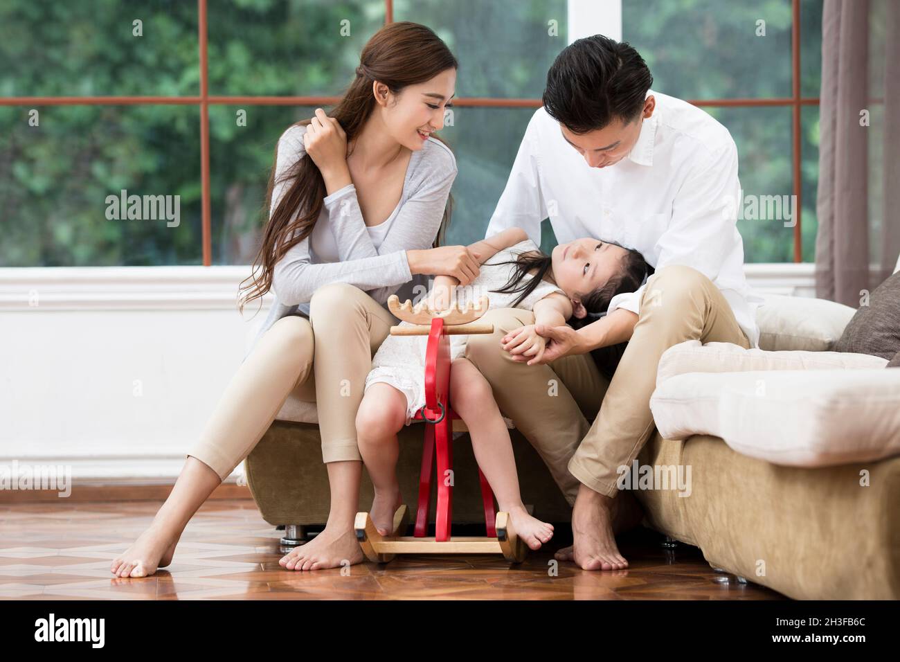 Warm and loving family of three Stock Photo - Alamy