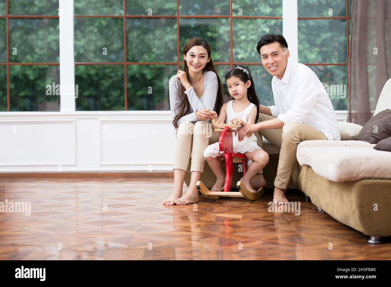 Warm and loving family of three Stock Photo - Alamy