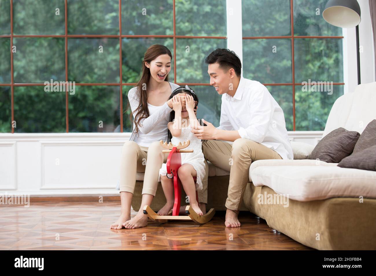 Warm and loving family of three Stock Photo - Alamy