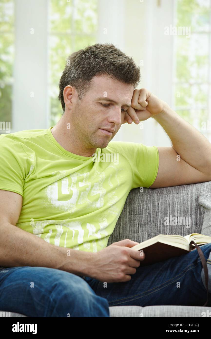 Man reading book Stock Photo - Alamy