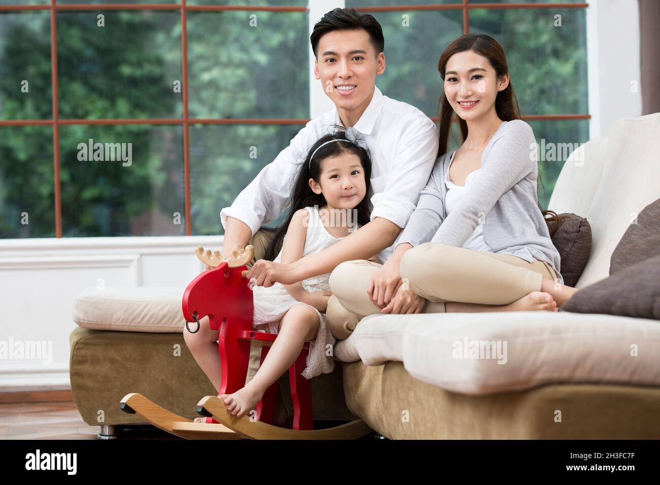 Warm and loving family of three Stock Photo - Alamy