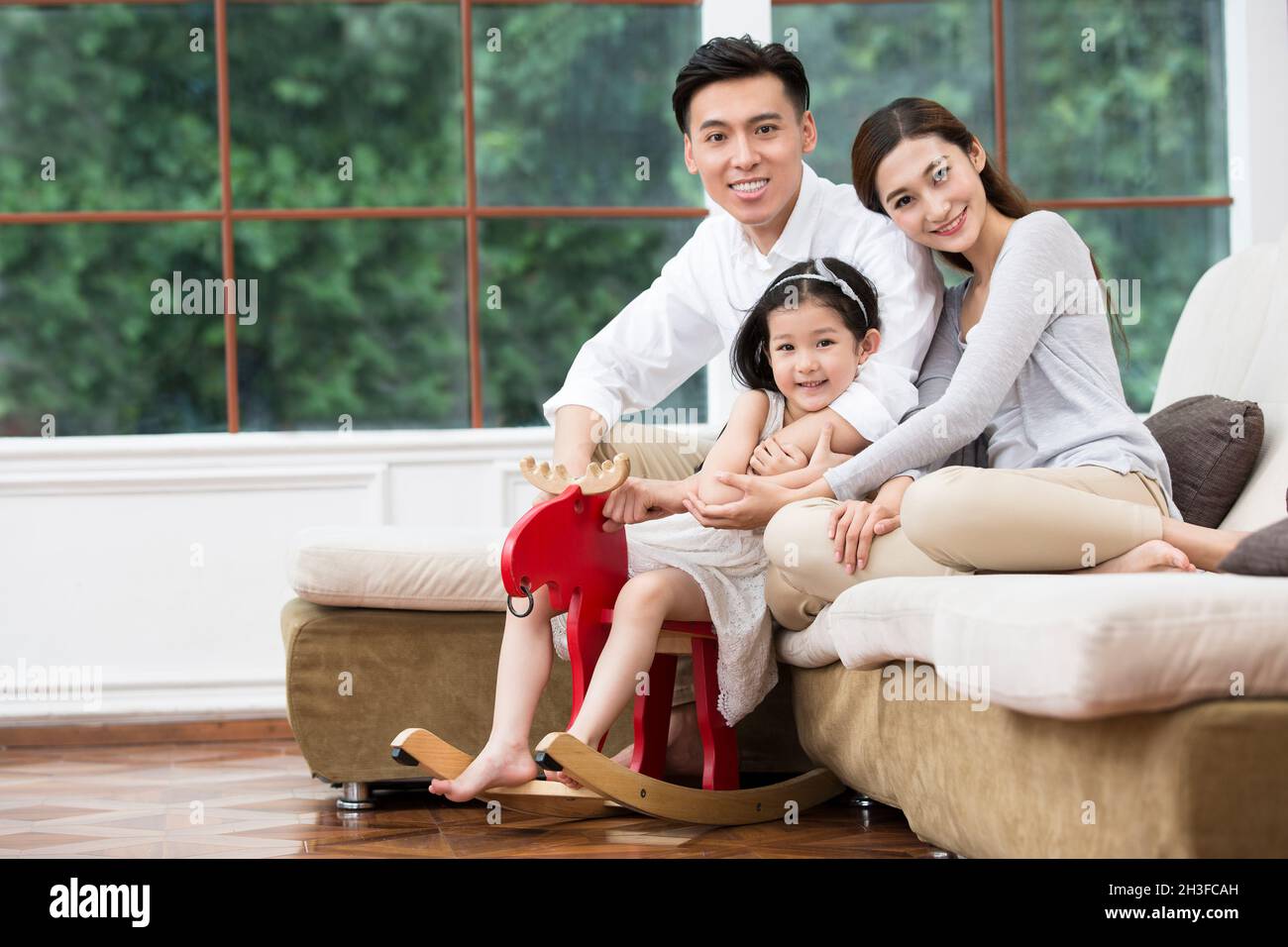 Warm and loving family of three Stock Photo - Alamy