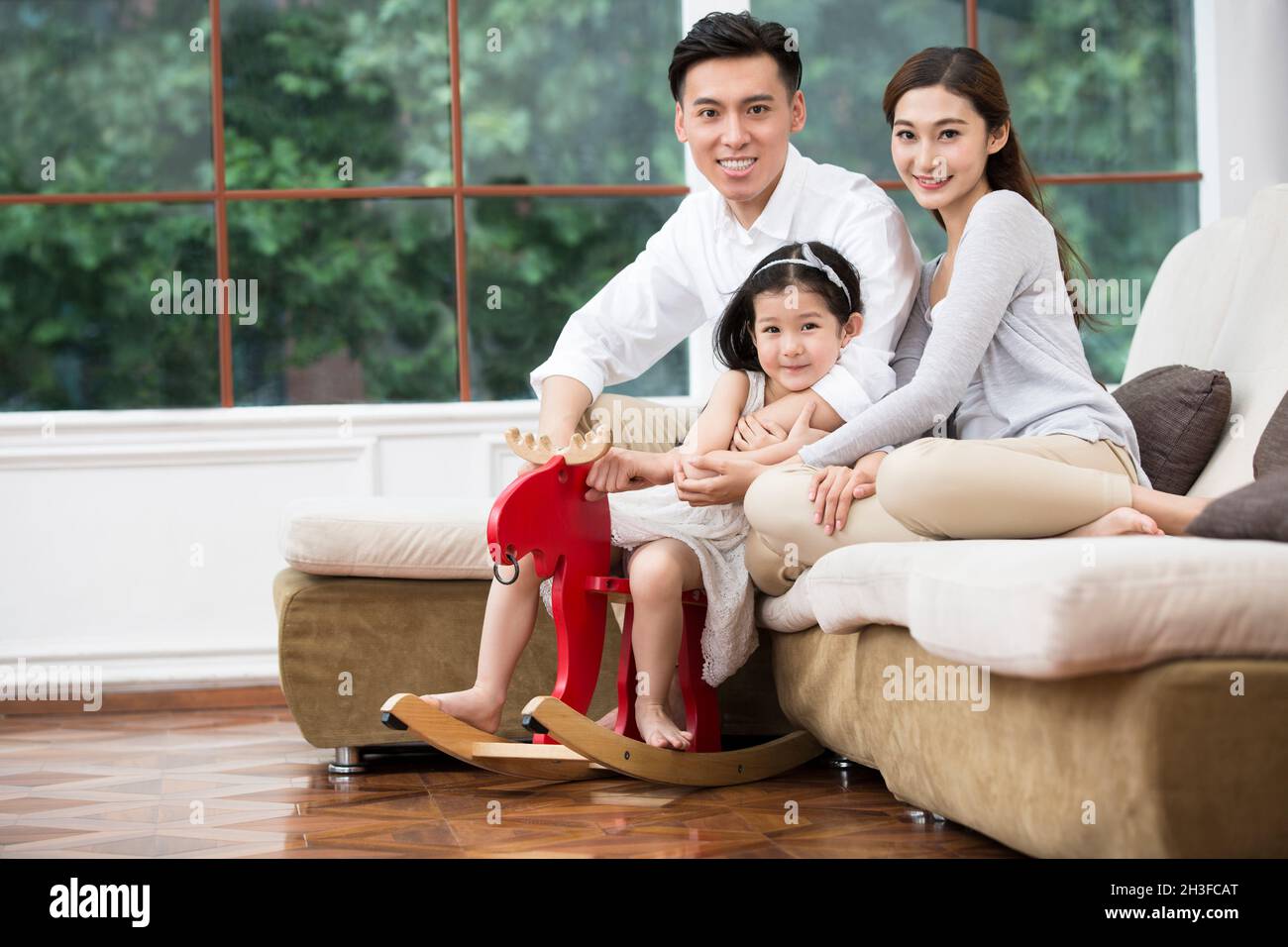 Warm and loving family of three Stock Photo - Alamy