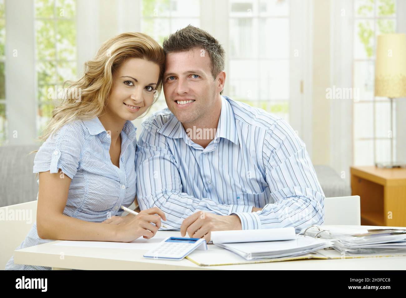 Cuople planning at home Stock Photo - Alamy